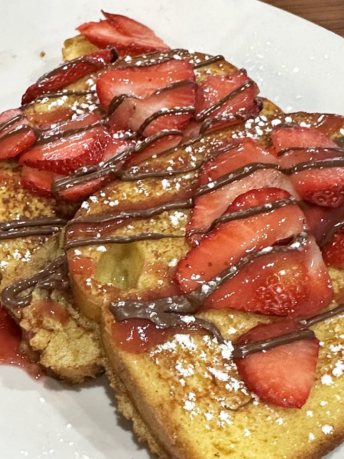 Strawberry Nutella French Toast that doesn't just satisfy your sweet tooth – it throws it a parade complete with powdered sugar confetti.