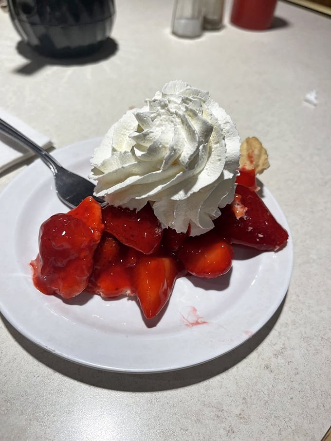 Strawberry pie that makes you understand why people write songs about summer – fresh berries nestled in their natural juices, crowned with real whipped cream.