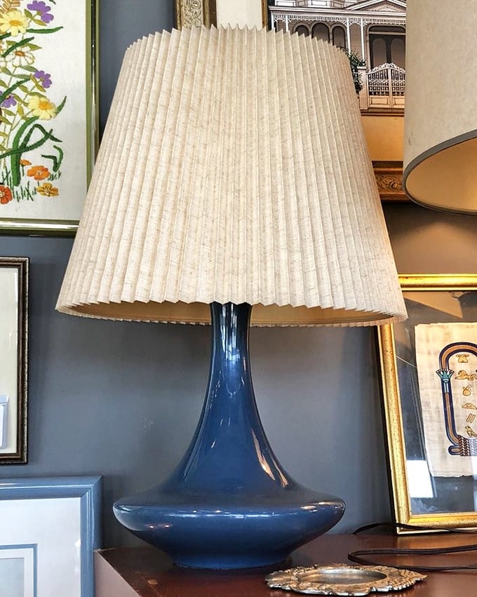 That blue lamp isn't just lighting up a room—it's lighting up a design conversation. Mid-century modern meets Florida sunshine in perfect harmony.