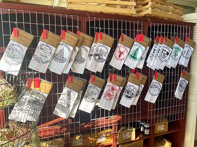 These aren't just tea towels—they're geography lessons hanging on display. Each one a souvenir from places someone loved enough to remember.