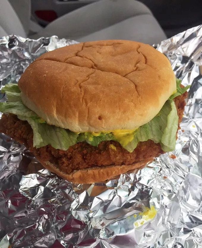 The tenderloin sandwich—a Midwest masterpiece where the meat extends well beyond the bun's borders like a crispy golden halo.