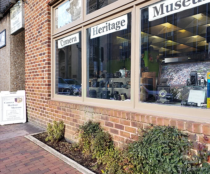 The Camera Heritage Museum storefront, where vintage cameras get more respect than your smartphone ever will.