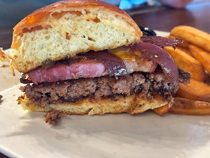The Slab Burger doesn't just satisfy hunger – it conquers it with layers of beef, ham, and melty cheese on a pillowy brioche throne.