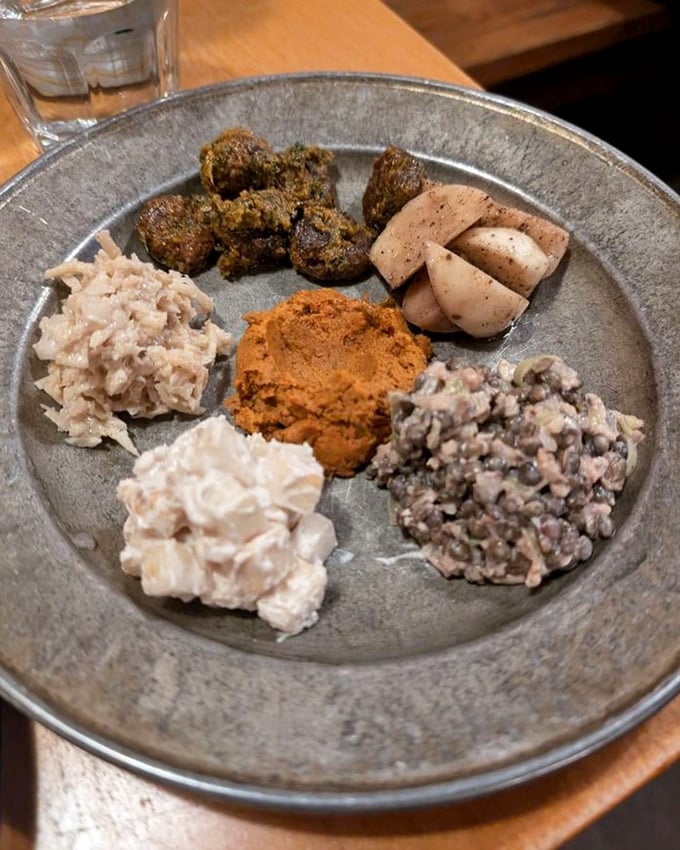 A tasting plate that's like Eastern Europe's greatest hits album—each bite offering a different note in this symphony of pickled, fermented, and smoked delights.