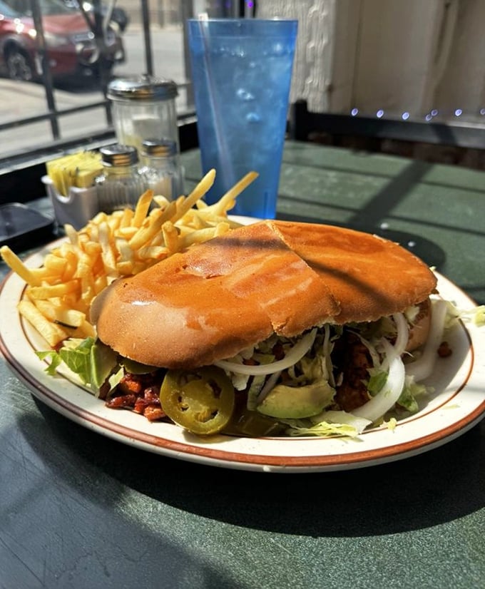 This torta comes loaded with enough toppings to require jaw-unhinging skills you haven't needed since that snake documentary.