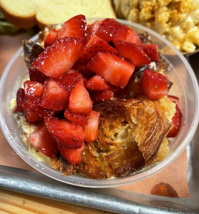This isn't just dessert, it's edible architecture – layers of custard, pastry and fresh strawberries that would make your grandmother both proud and jealous.