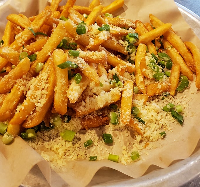 These aren't just fries—they're golden, crispy vehicles for parmesan and herbs that make regular fries seem like they're not even trying.