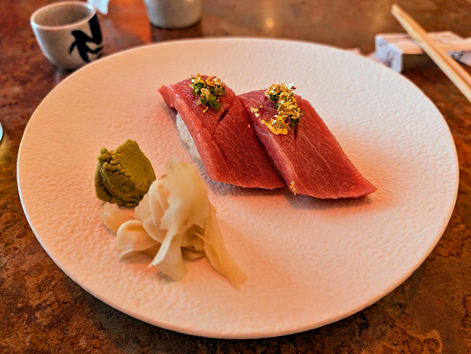 Tuna nigiri topped with gold flakes – because sometimes Tuesday deserves a touch of luxury that doesn't require a second mortgage.