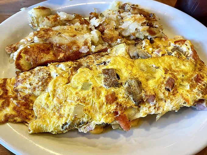 The Ultimate Omelette lives up to its name—a yellow canvas painted with all the breakfast favorites your heart desires.