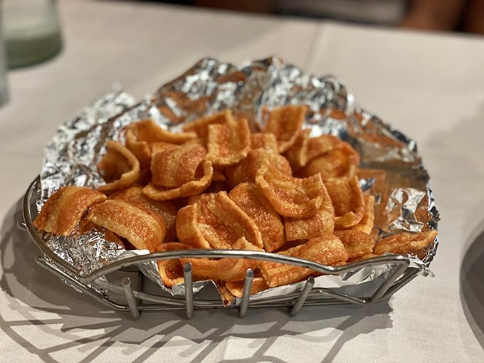 These aren't your average pork rinds—they're crispy little flavor bombs that make excellent vehicles for whatever you're drinking.