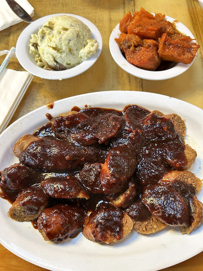 These sides aren't afterthoughts—they're co-stars. Mashed potatoes that could make a Frenchman weep and yams sweet enough to be dessert.
