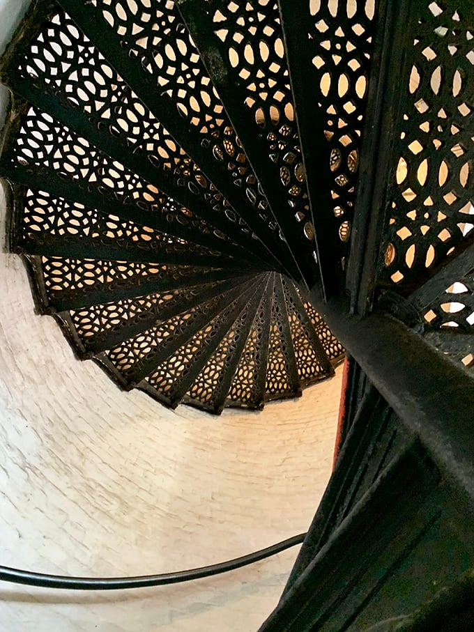 The intricate ironwork of these spiral stairs tells its own story—functional art that's been guiding keepers upward since the Victorian era.
