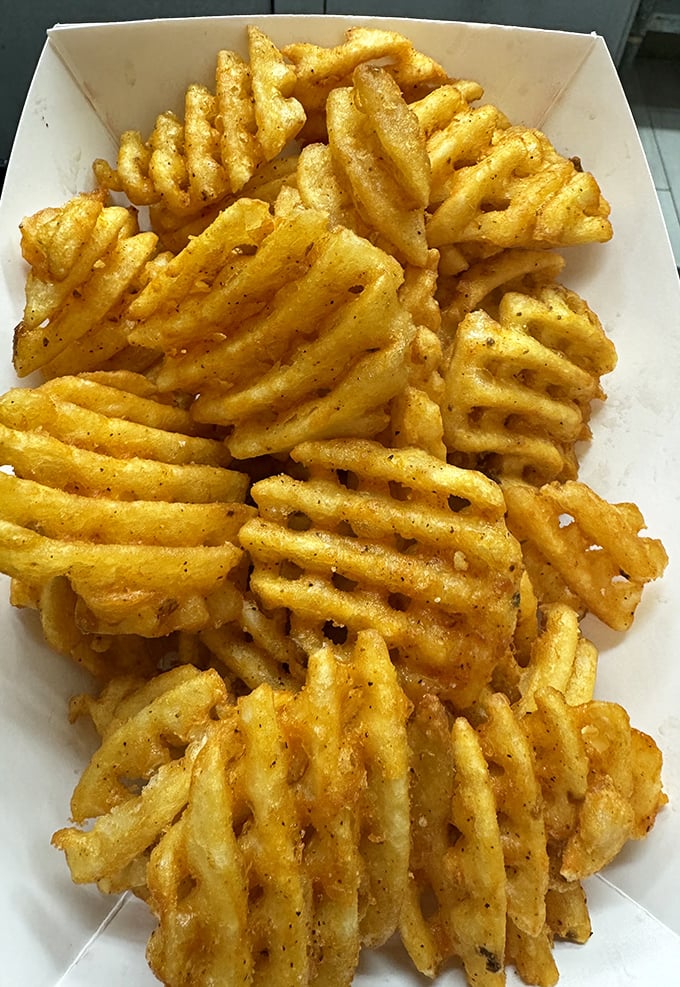 Not just fries—waffle fries. The extra surface area isn't just for show—it's more real estate for seasoning to call home.