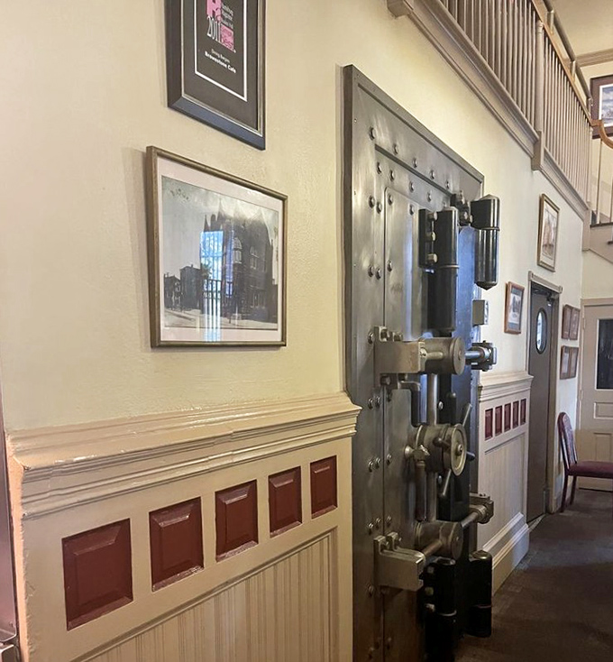 Not just wall decor—that's an actual vintage bank vault door, serving as a reminder that the real treasures here are culinary, not currency.