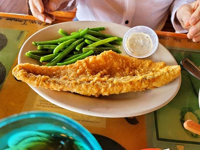 Lake Erie walleye, golden-fried to perfection with fresh green beans – a local catch that rivals its oceanic cousins in both flavor and satisfaction.