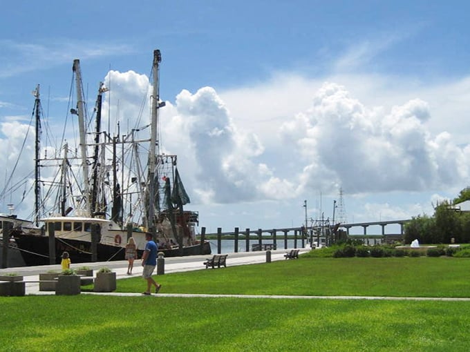 Working waterfront meets postcard perfection as fishing vessels return with the day's catch – seafood doesn't get fresher unless you're wearing fins yourself.