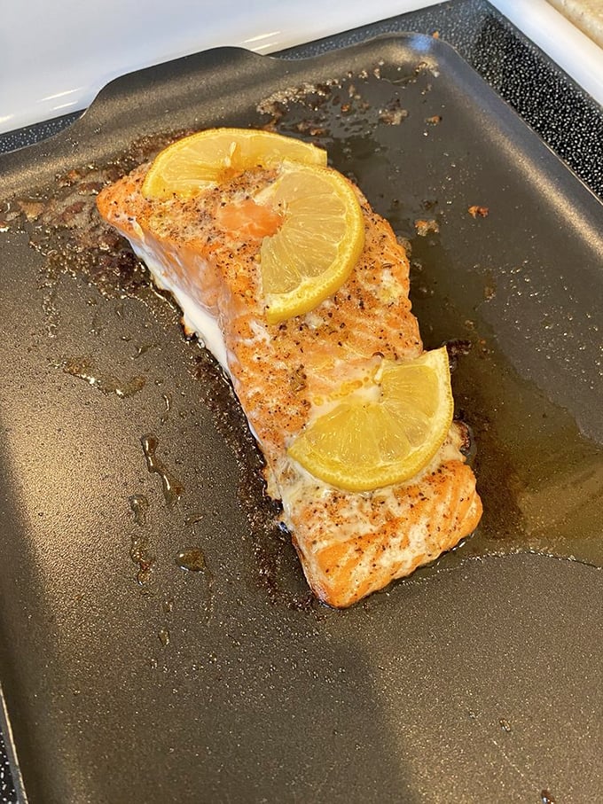 Simple perfection: wild salmon with citrus that needs no elaborate disguise—just pristine fish cooked with the respect it deserves.