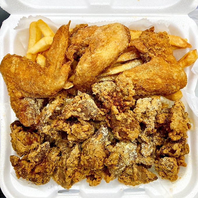 Wings and livers sharing real estate in one container – democracy in action, folks, and it's delicious.