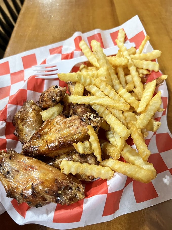 Wings and crinkle-cut fries: the dynamic duo of comfort food that reminds you some of life's greatest pleasures come in baskets lined with checkered paper.