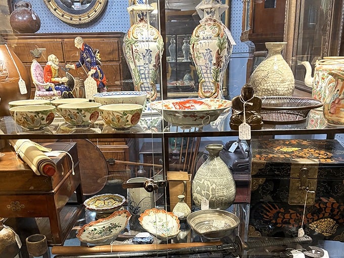 Porcelain perfection behind glass. These delicate treasures survived decades of dinner parties and family feuds to end up magnificently displayed for your consideration.