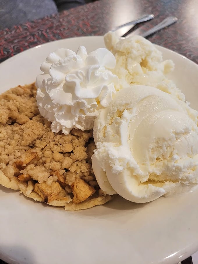 Apple pie à la mode: America's dessert ambassador. Two scoops of vanilla ice cream creating the perfect hot-cold romance with that crumbly crust.