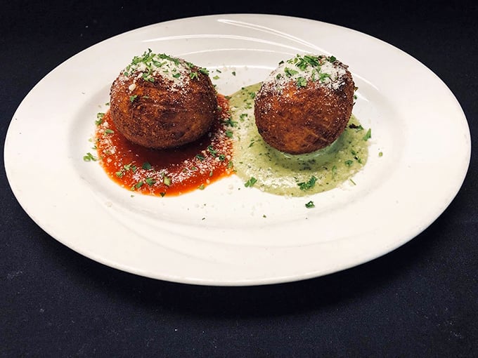 These arancini balls sitting in two different sauces are like the diplomatic ambassadors of Italian street food—crispy, sophisticated, and impossible to resist.