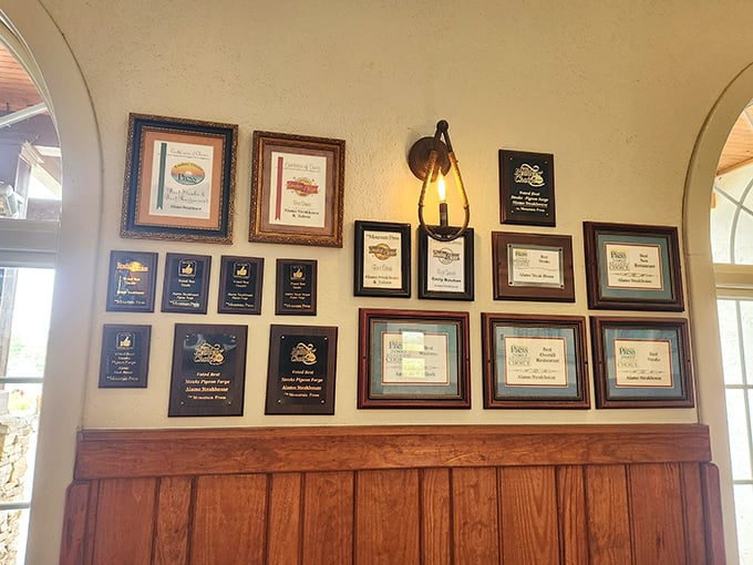 The wall of awards isn't just decoration – it's a timeline of excellence that explains why you'll need to loosen your belt before leaving.