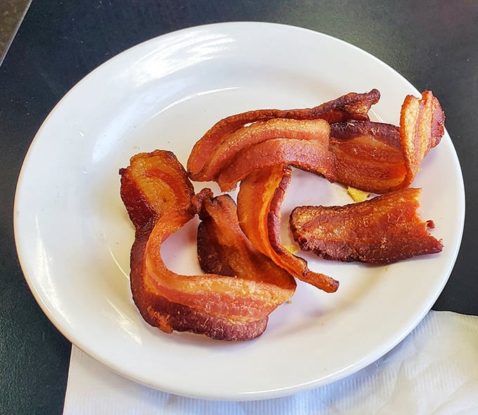 Bacon isn't just a breakfast side—it's the supporting actor that steals the show. These crispy strips deserve their own standing ovation and possibly fan mail.