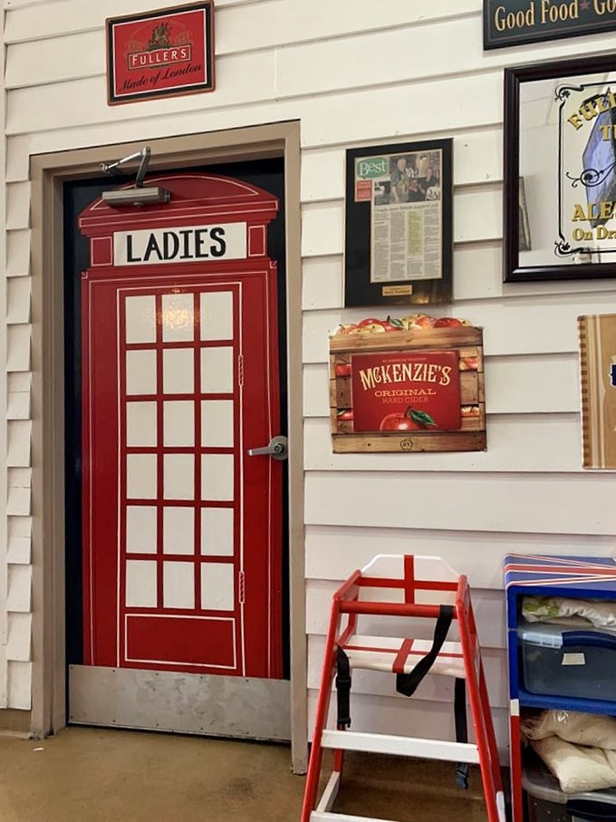 Even the restroom door gets the British treatment – a classic red telephone box that makes answering nature's call feel like an international affair.