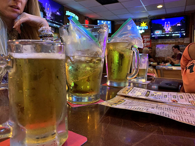 Cold beer in frosty mugs – civilization's perfect answer to Florida heat and spicy wings. The condensation tells you everything you need to know.
