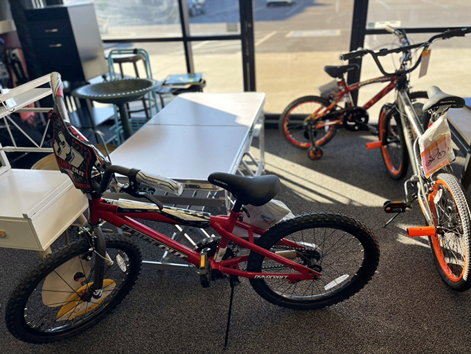 Kids' bikes waiting for their next adventure. One man's outgrown two-wheeler is another child's ticket to neighborhood exploration and skinned knee memories.