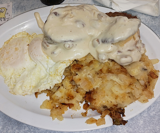 Biscuits and gravy with a side of eggs—where comfort food meets artistic expression in a symphony of savory that makes your fork the conductor.