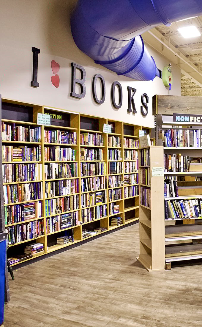 The book section—a literary potluck where Stephen King might share shelf space with Julia Child and someone's discarded self-help revelation. 