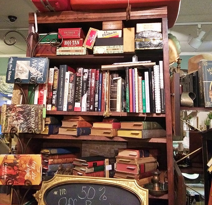 A bibliophile's dream corner where vintage cigar boxes meet leather-bound classics – proof that books were meant to be both read and displayed.
