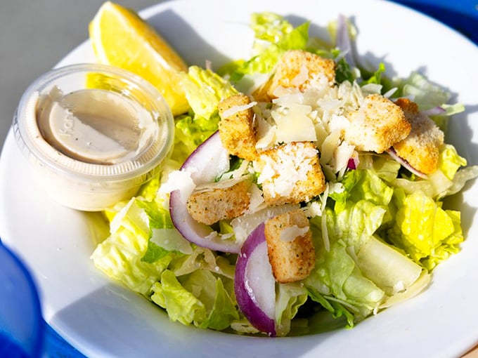 A Caesar salad that knows its role—bringing just enough green to the table without stealing the seafood spotlight.