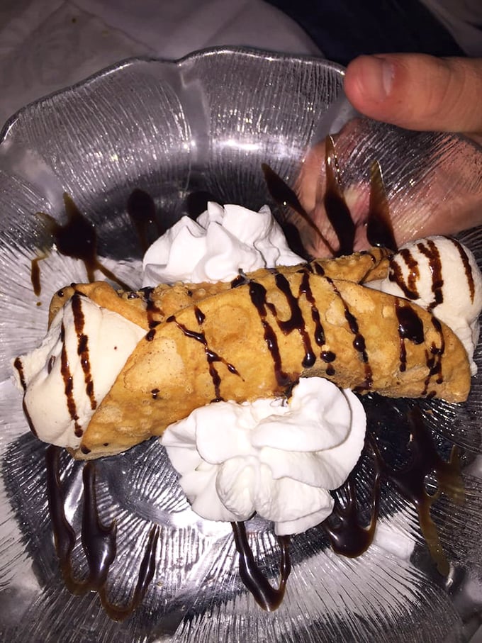 This cannoli isn't just dessert—it's the grand finale! Crispy shell, cloud-like filling, and chocolate drizzle performing the encore.