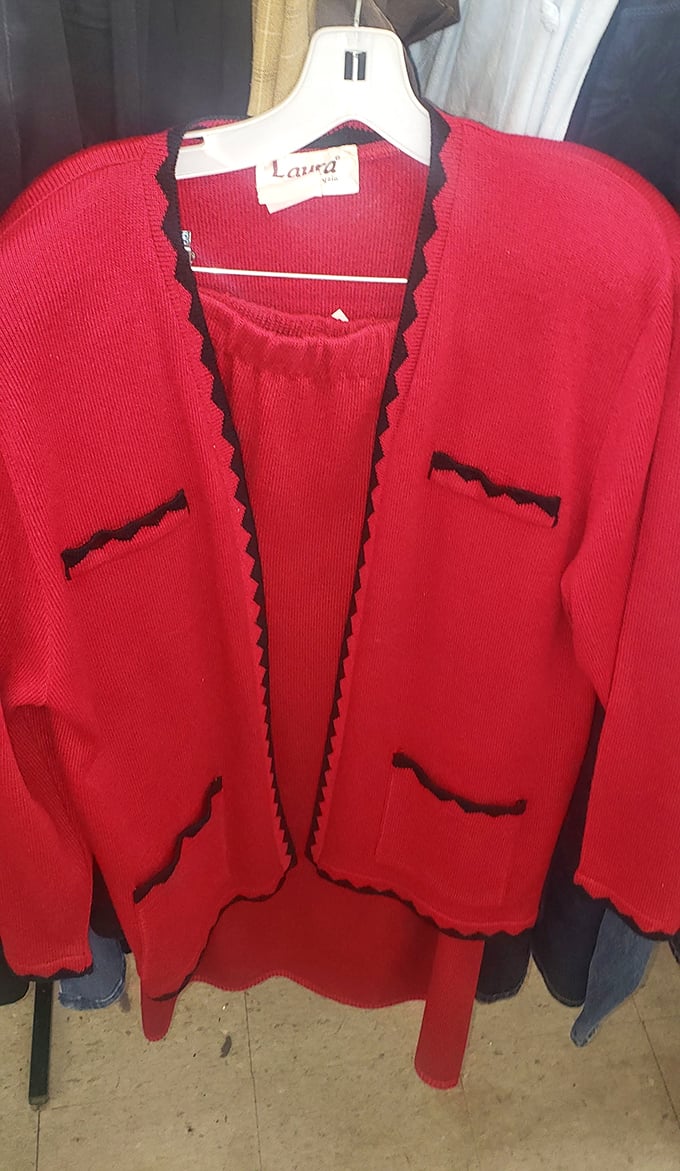 This vibrant red cardigan with black trim screams "1980s power lunch" – pair with shoulder pads for the full Reagan-era effect.