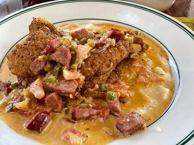Southern comfort in its purest form—crispy catfish swimming in a sea of creamy, savory goodness. Diet culture weeps in the corner.