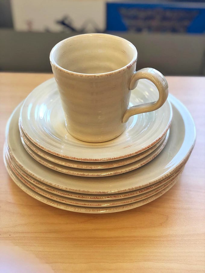 Mismatched perfection—this cream ceramic dishware set proves that sometimes the most charming table settings come from thrift store shelves, not wedding registries.