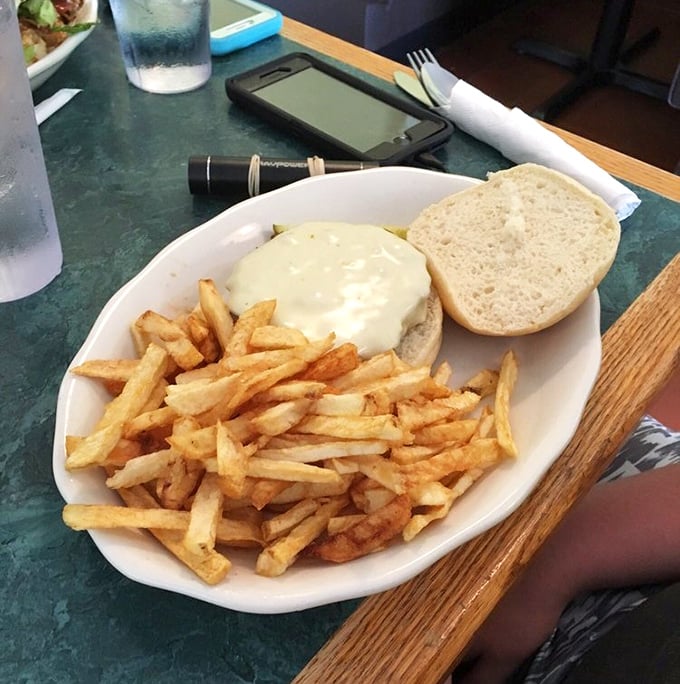 A cheeseburger and fries that remind you why sometimes the classics don't need reinvention – they just need to be done right, with proper respect.