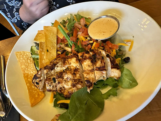 A salad that actually satisfies! Perfectly grilled chicken atop fresh greens with house-made dressing—proof that "eating healthy" and "enjoying life" aren't mutually exclusive.