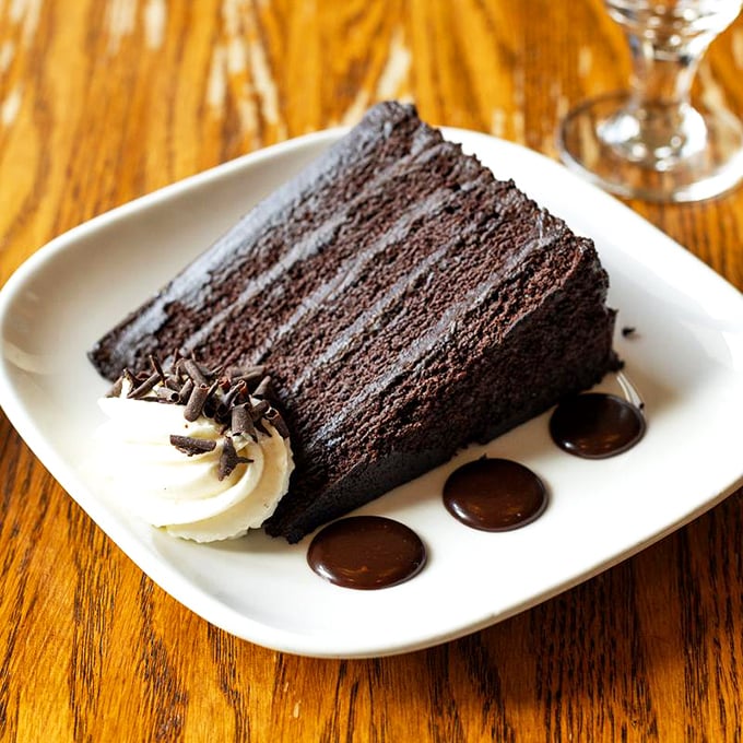 Layer upon layer of chocolate decadence—this cake doesn't just satisfy your sweet tooth, it throws a party for it.