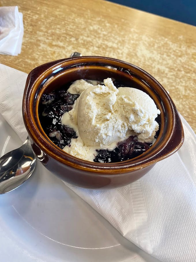 Warm cobbler topped with ice cream—the dessert equivalent of a hug from someone who really knows how to hug.
