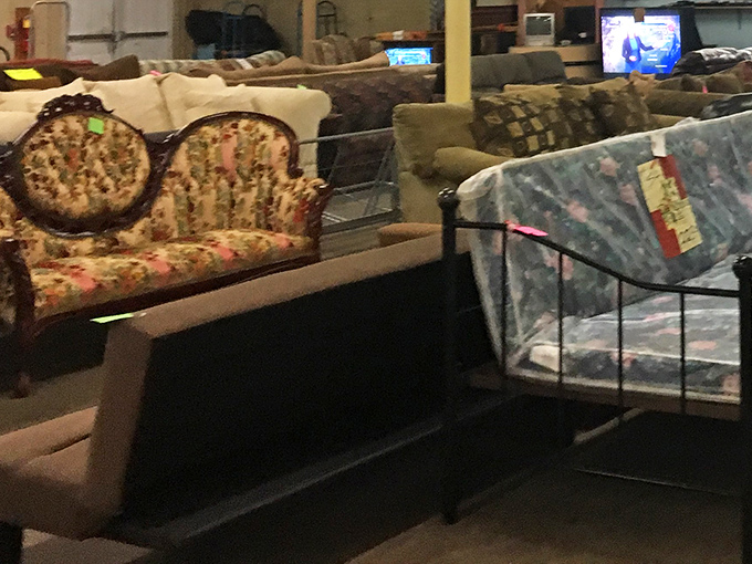 That floral couch might have witnessed family TV nights in the 80s, now waiting for its second act in someone's vintage-loving living room.