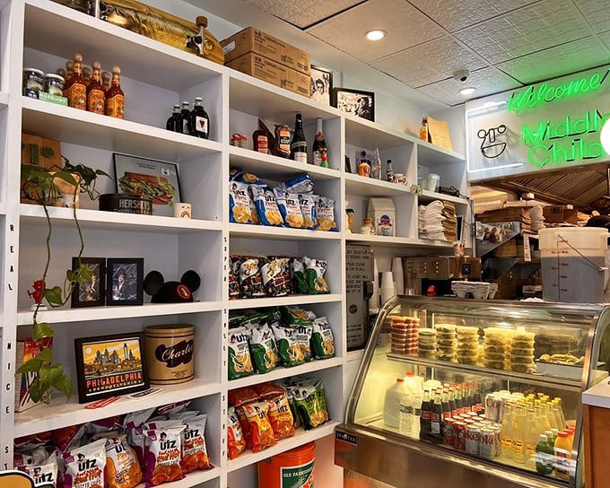 Shelves stocked with carefully curated snacks and drinks—the supporting cast to the sandwich stars, waiting patiently for their moment to shine.