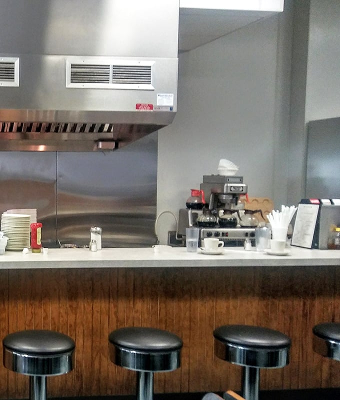 Counter seating: where the real diner magic happens. Watch your breakfast being made while eavesdropping on conversations that are better than any podcast.