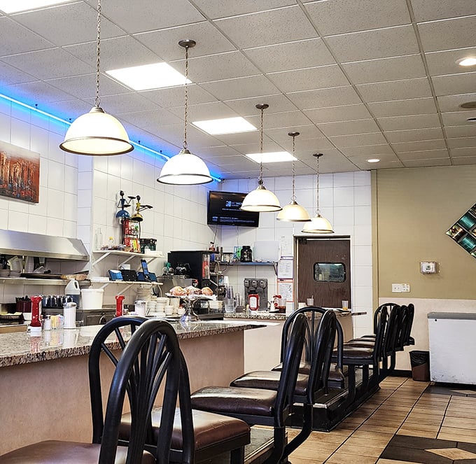 Counter seating: where solo diners become temporary family, united under the warm glow of pendant lights and breakfast possibilities.