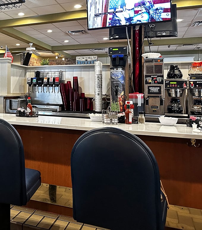 The counter seating area—where coffee magic happens and breakfast dreams come true. Those coffee machines have witnessed countless morning revelations.