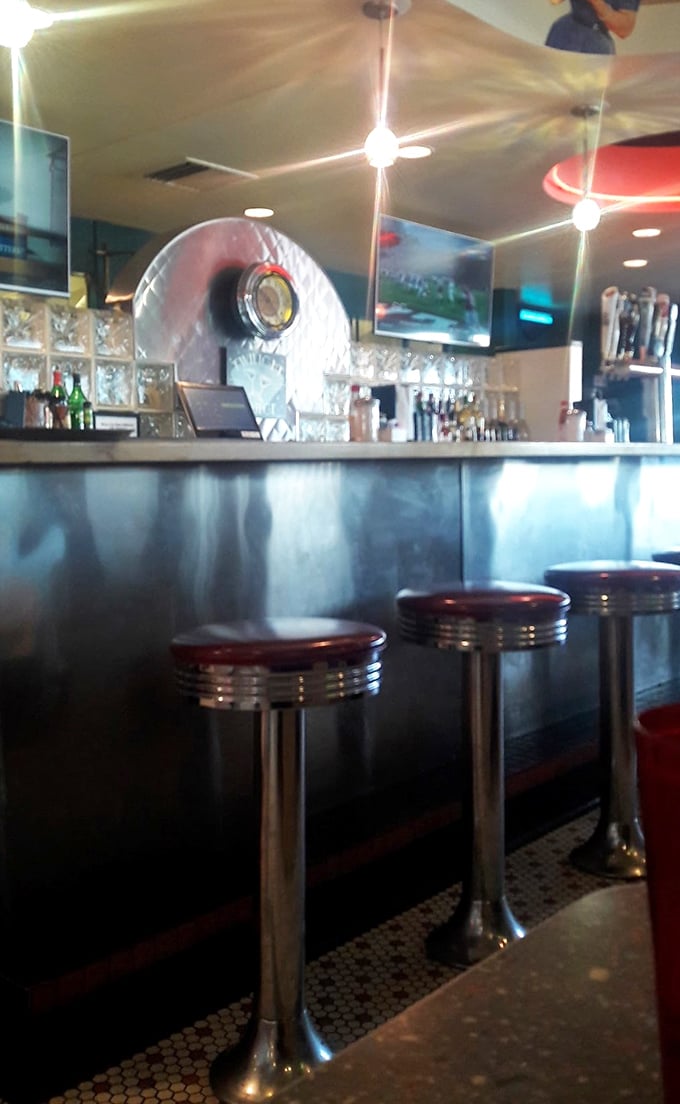 The counter seating—that quintessential diner feature—invites solo diners to perch on chrome stools for front-row views of short-order magic.