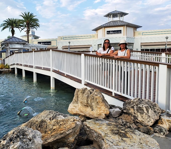 The white boardwalk offers perfect vantage points for enjoying water features—and catching your breath between shopping sprints.